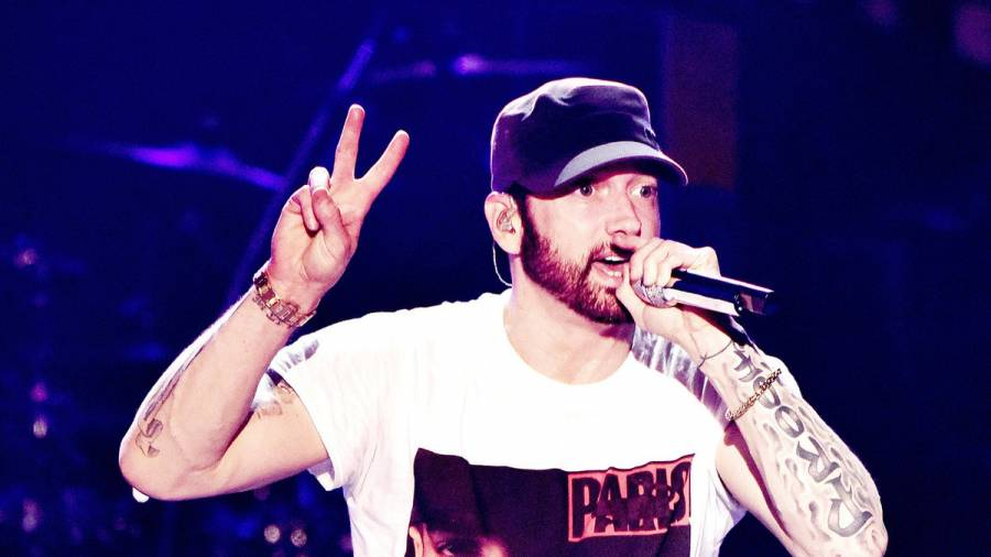 Eminem surprises a woman holding a baby crying over losing her job and ...